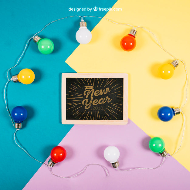 Free New Year Mockup With Slate And Bulbs Psd – CreativeBooster